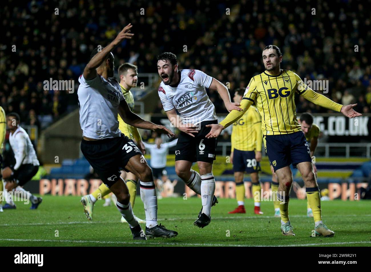 Derby County's Eiran Cashin (centre) celebrates scoring his sides third ...