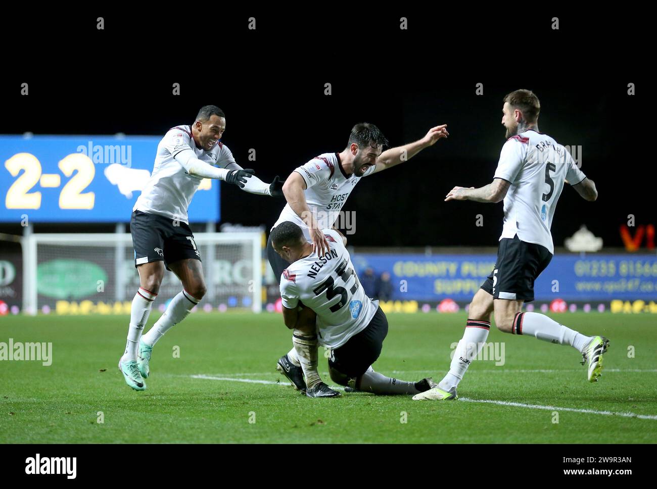 Derby County's Eiran Cashin (top centre) celebrates scoring his sides ...