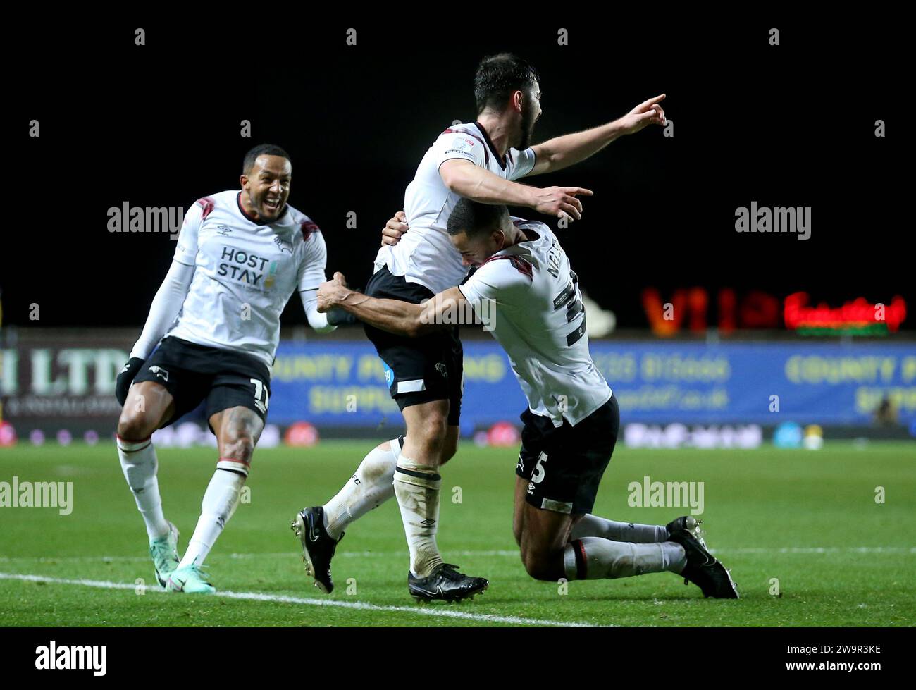 Derby County's Eiran Cashin (centre) celebrates scoring his sides third ...