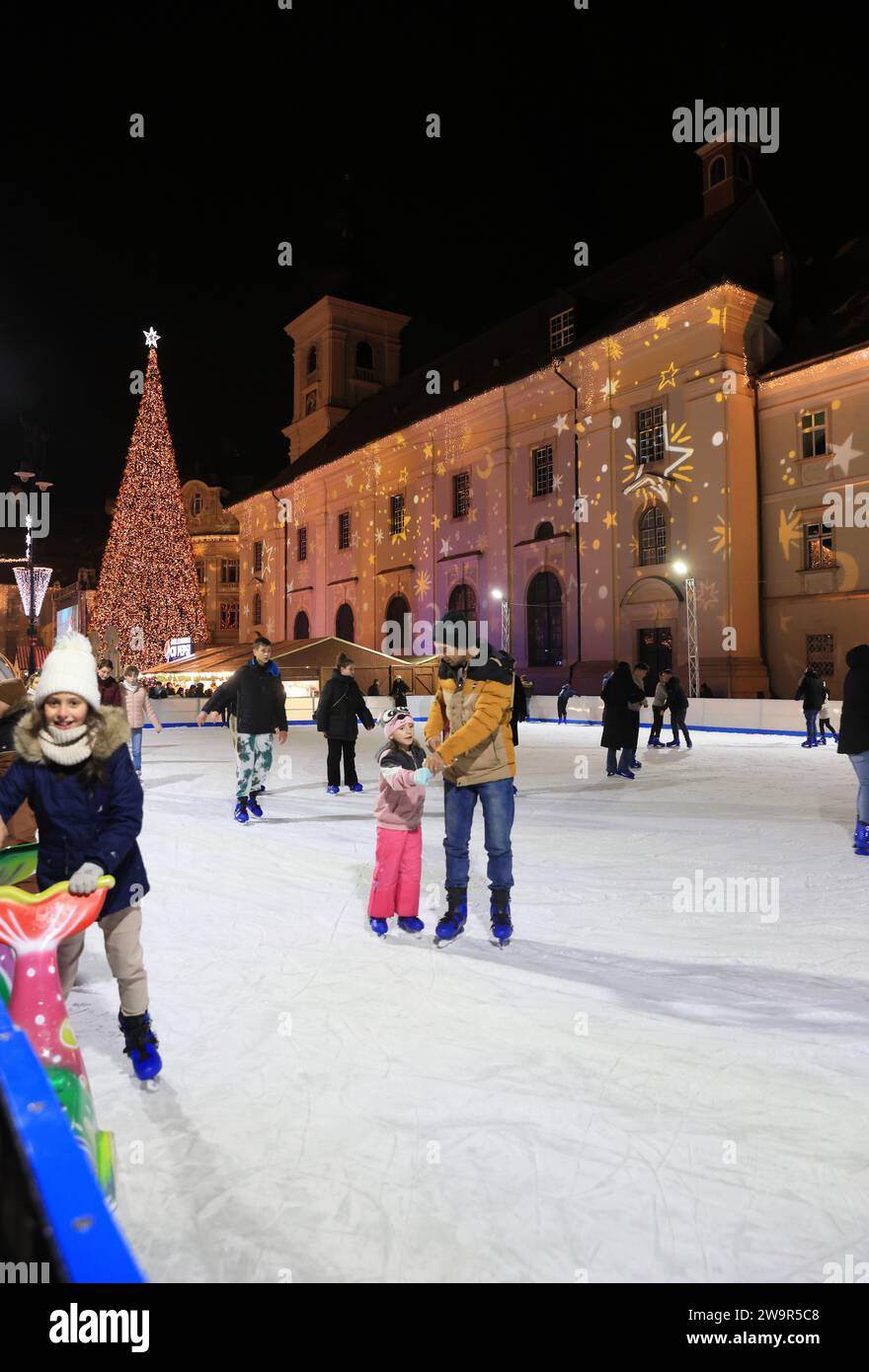 Ice skating on Piata Mare, the Big Square, in the historical city of ...