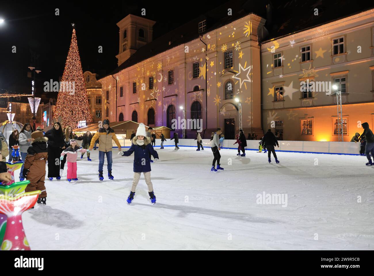 Ice skating on Piata Mare, the Big Square, in the historical city of ...