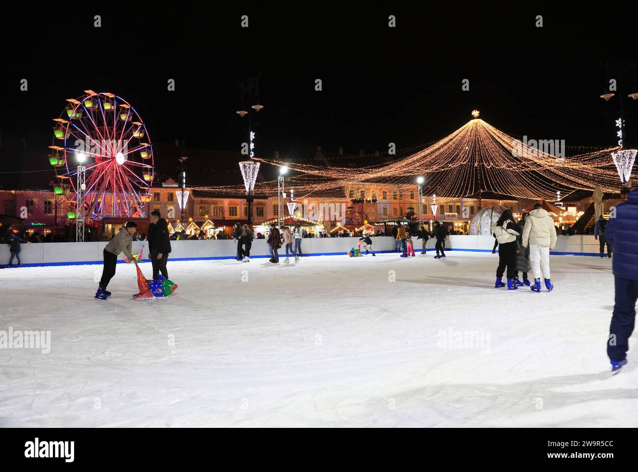 Ice skating on Piata Mica, the Big Square, in the historical city of ...