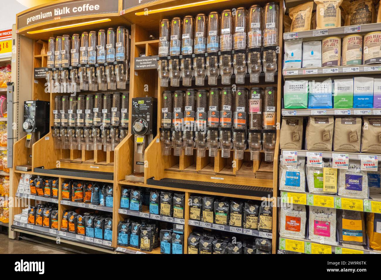 Supermarket bulk coffee selection display for self-service grinding and bagging assorted coffee ...