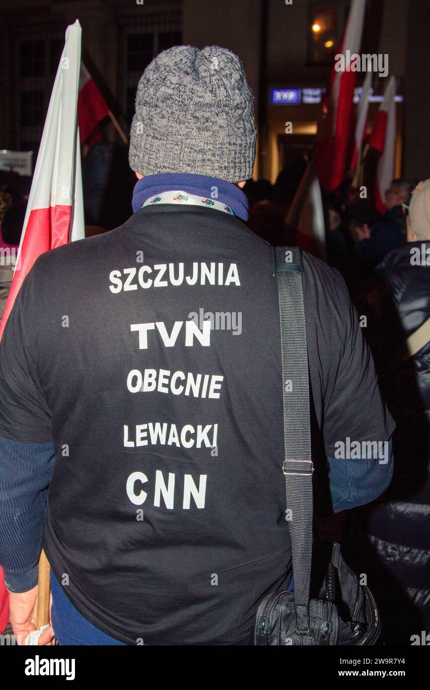 A person protests in defense of PiS influence on TVP, on a T-shirt ...
