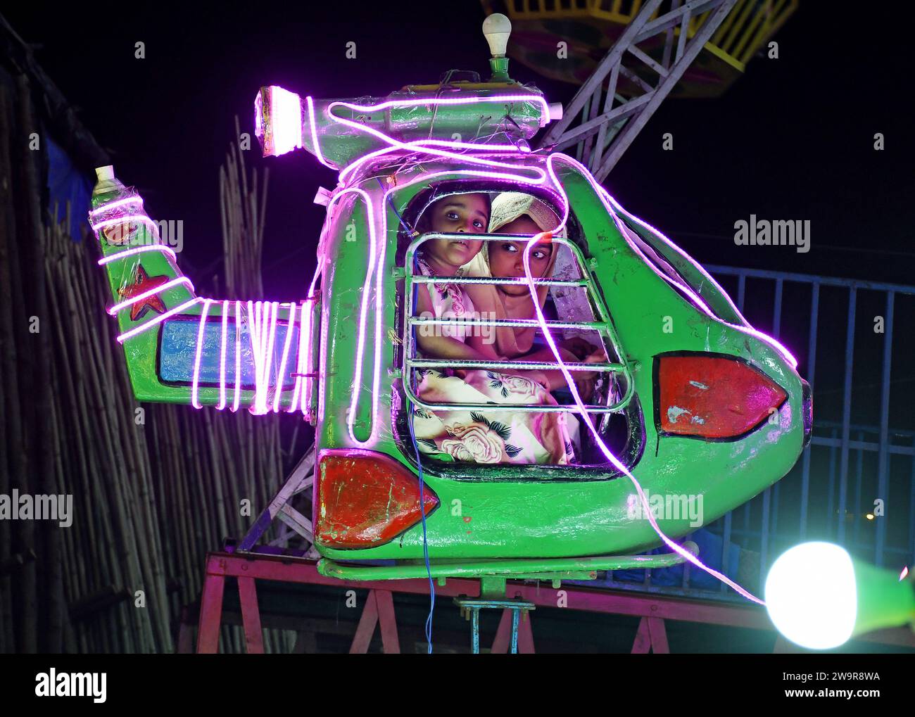 Mumbai, Maharashtra, India. 29th Dec, 2023. Girls enjoy helicopter ...