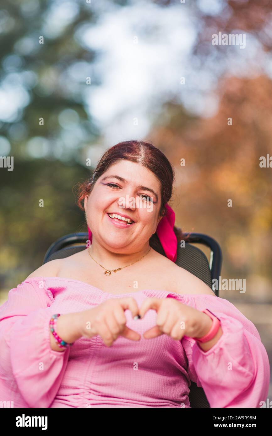 InspireInclusion heart shape, love valentine gesture. Young woman with ...