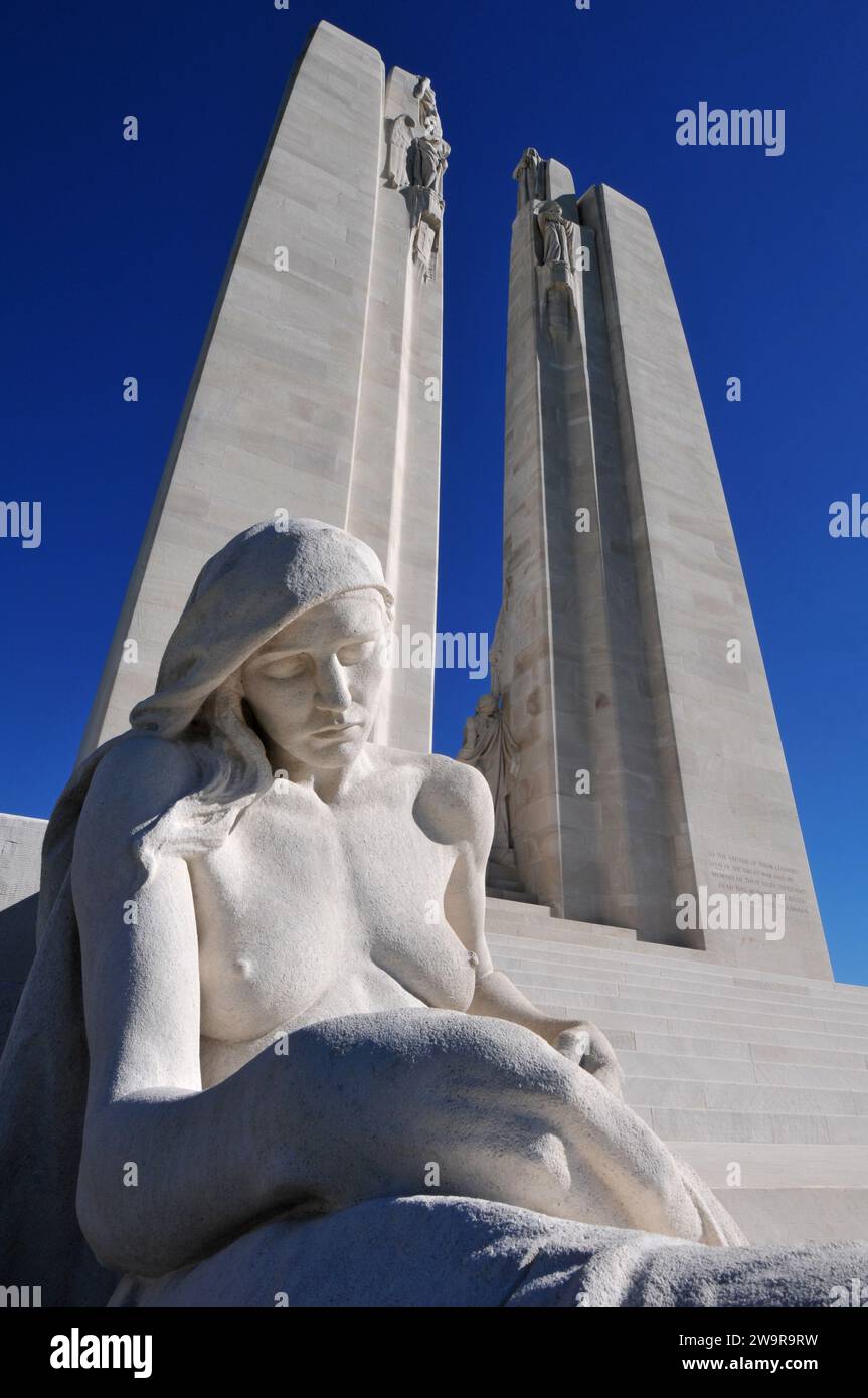 A sculpture of a female mourner at the base of the Canadian National ...