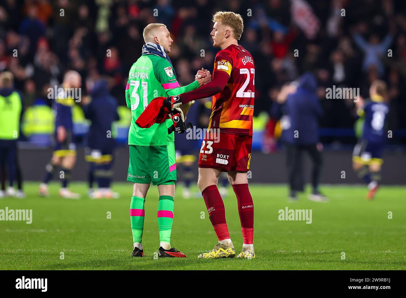 Huddersfield, UK. 29th Dec, 2023. Jacob Chapman #31 of Huddersfield Town and Tom Glover #23 of ...