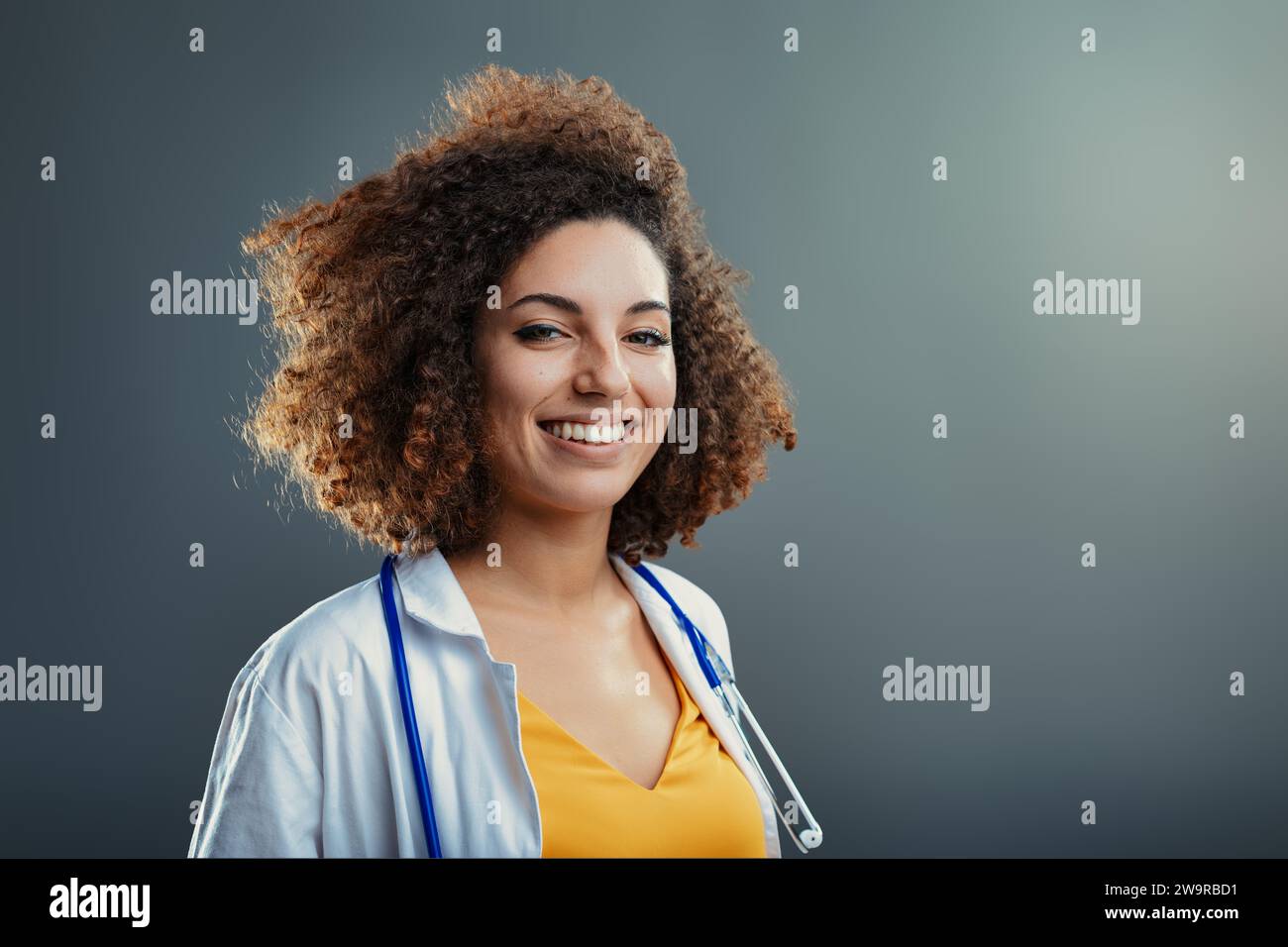 Friendly medical expert radiates approachability, her joyful demeanor ...