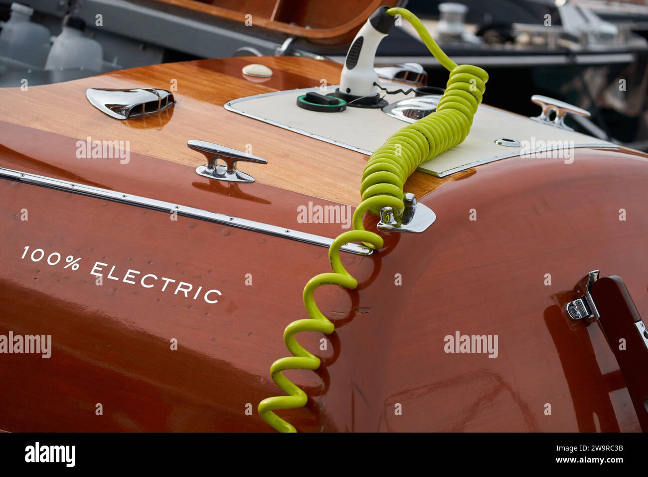 the wooden side of the modern electric elegance motor boat in port of ...