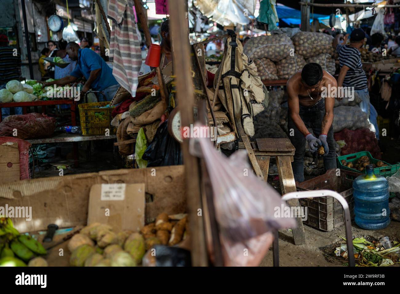 Vendors stock their fruits and vegetables stand at the "Mercado de las ...