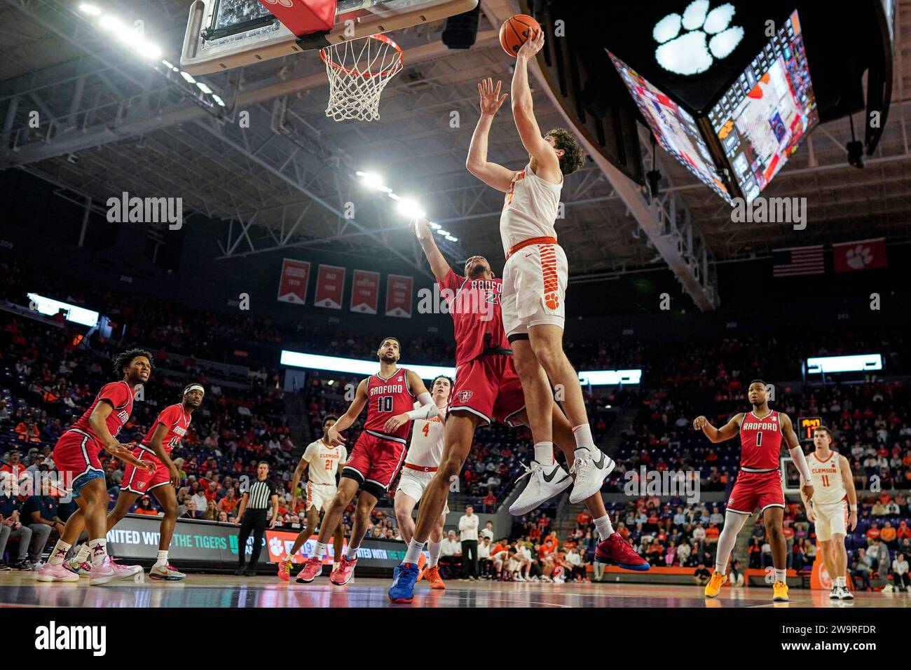 Clemson center PJ Hall (24) shoots against Radford center D'Auntray ...