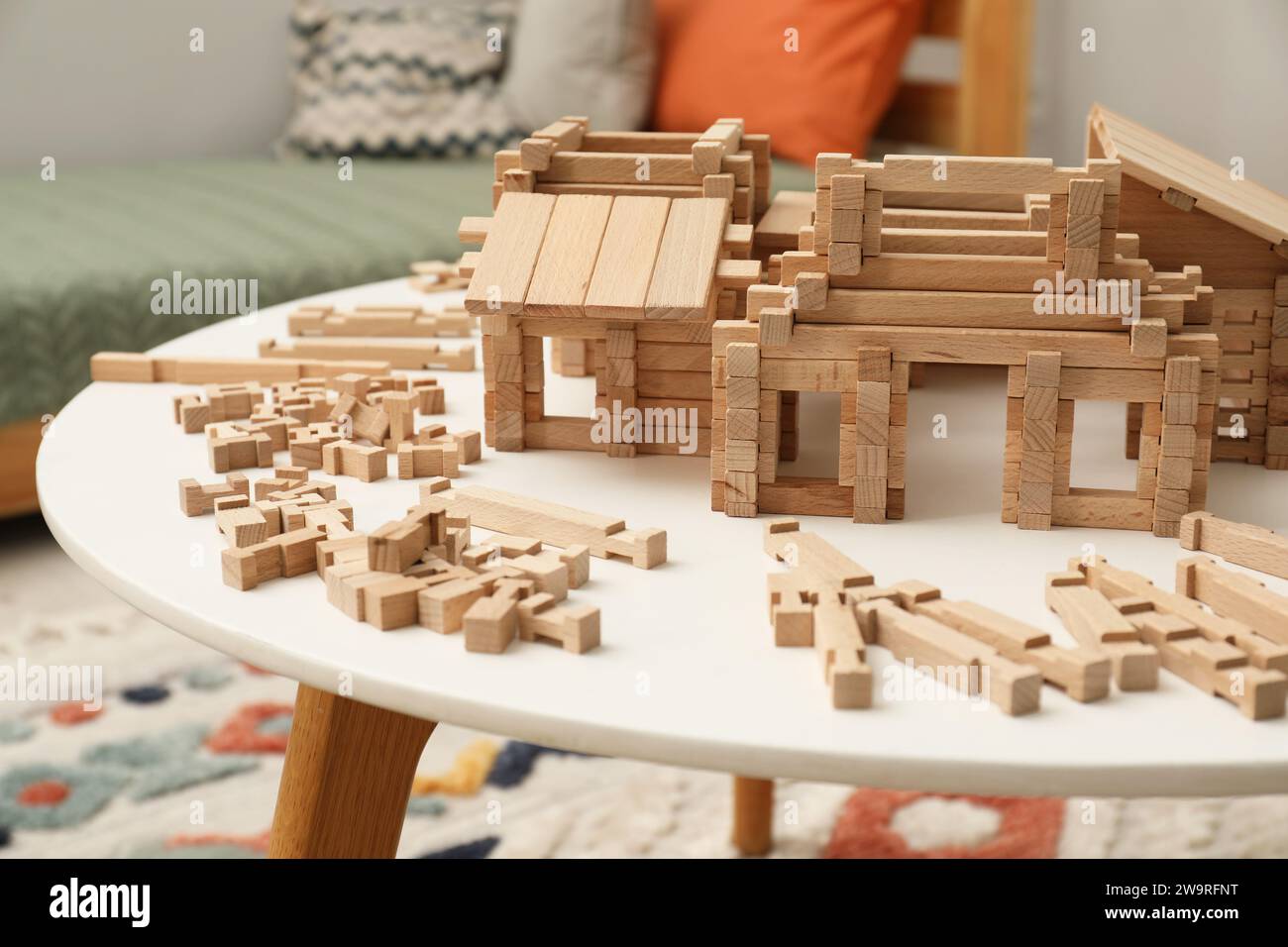 Wooden construction set on white table indoors. Children's toy Stock ...