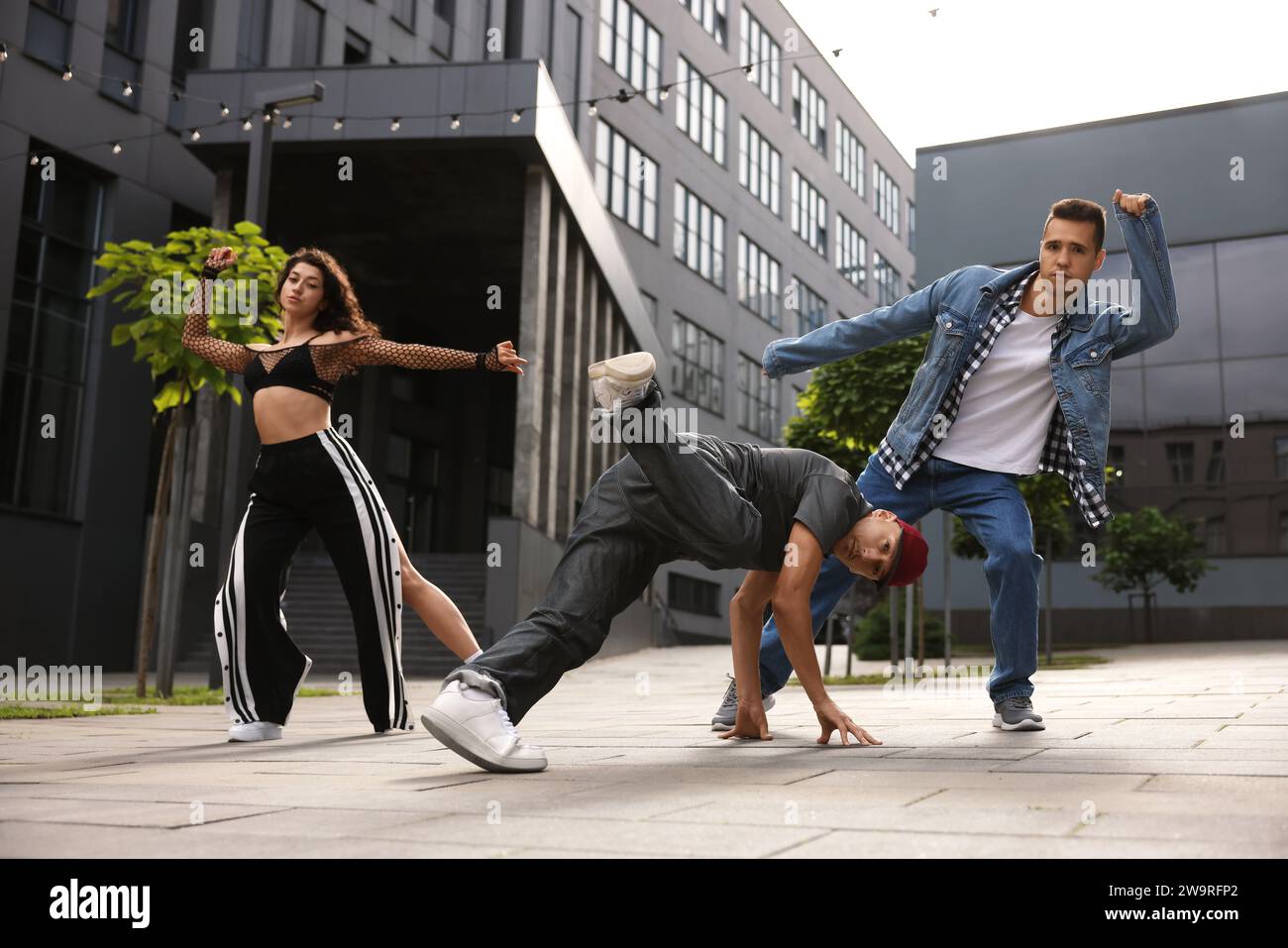 Group of people dancing hip hop outdoors Stock Photo - Alamy