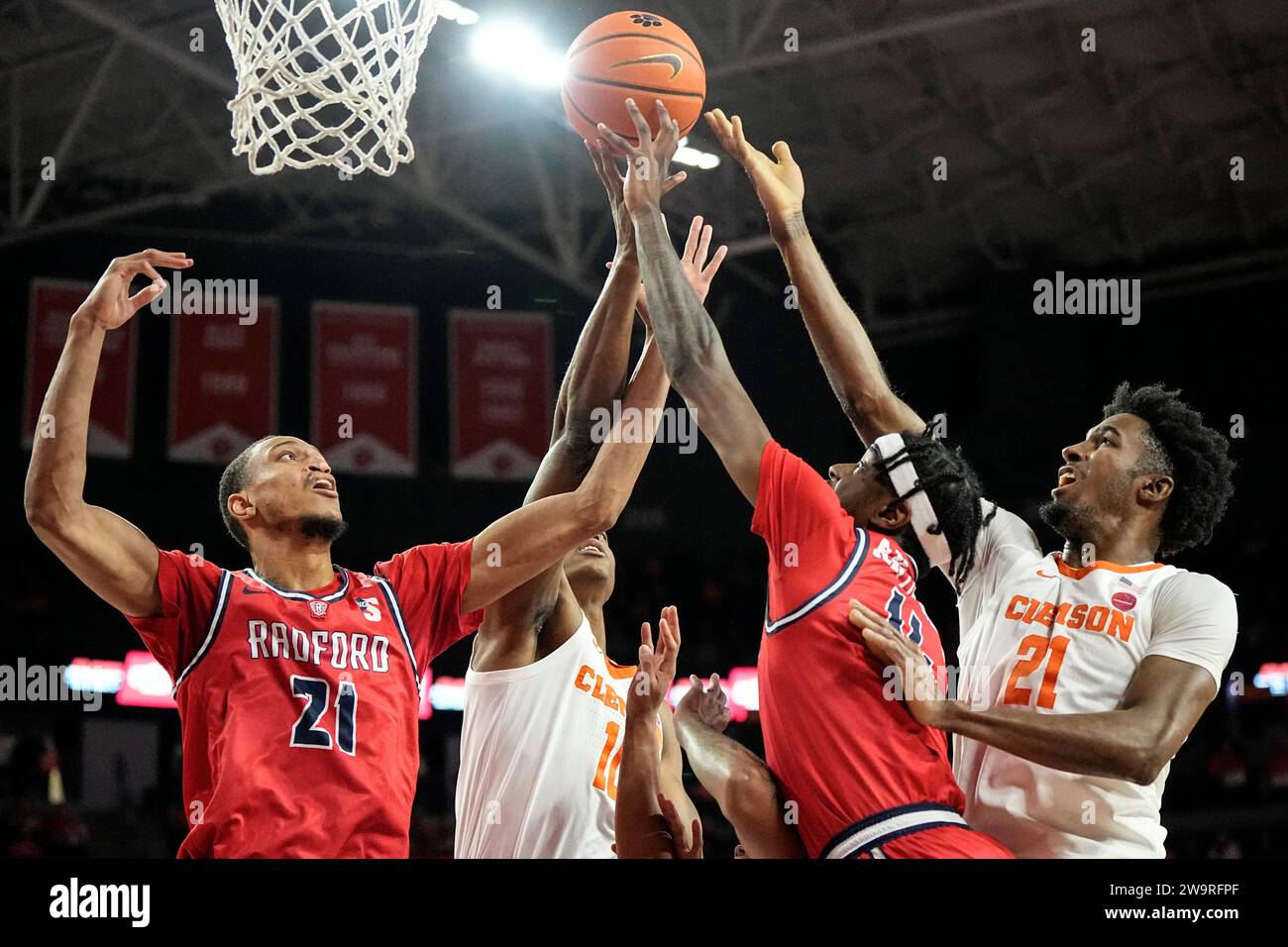 Clemson forward Chauncey Wiggins (21) and Radford center D'Auntray ...