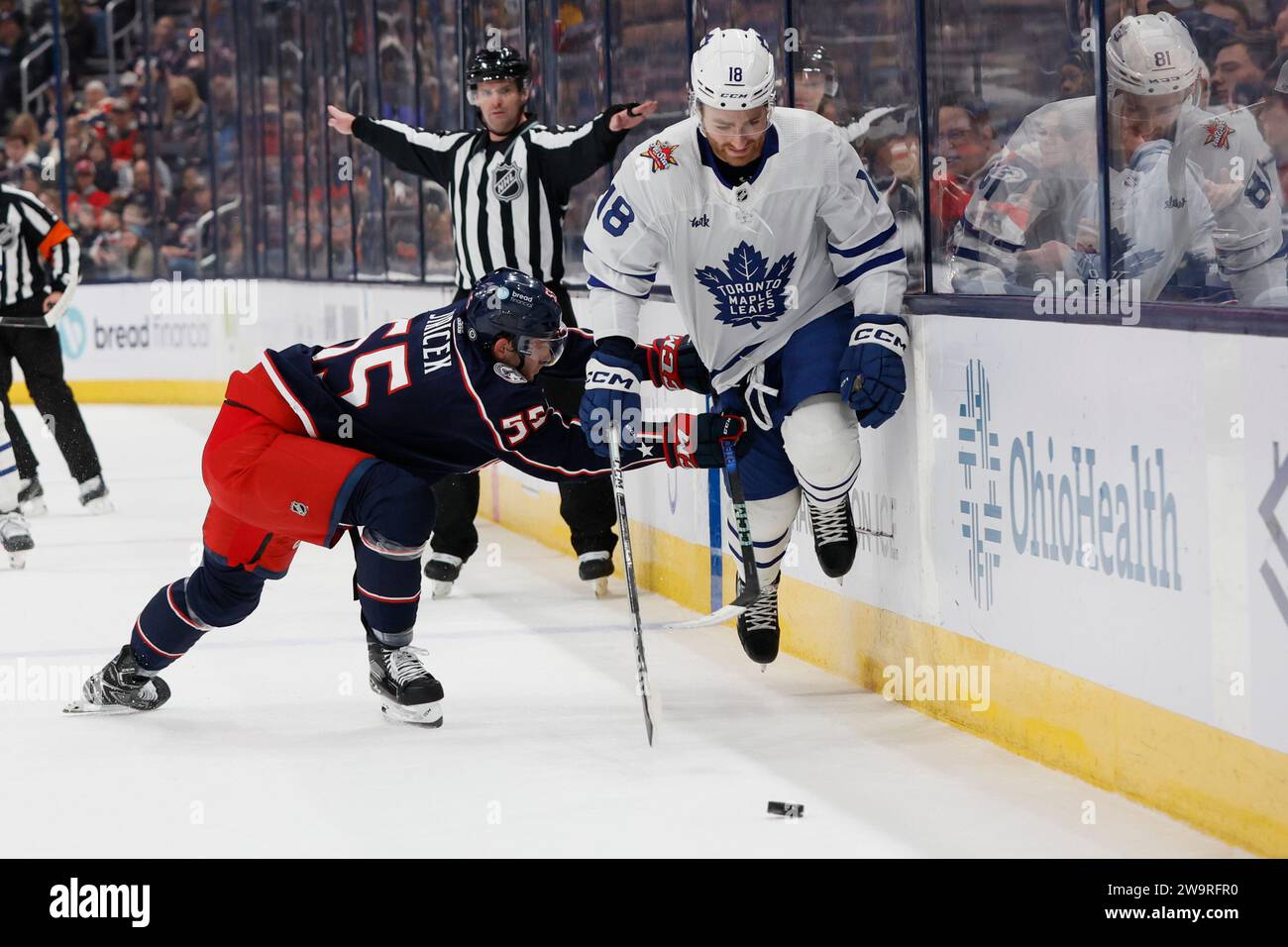 Toronto Maple Leafs' Noah Gregor, right, avoids a check by Columbus ...