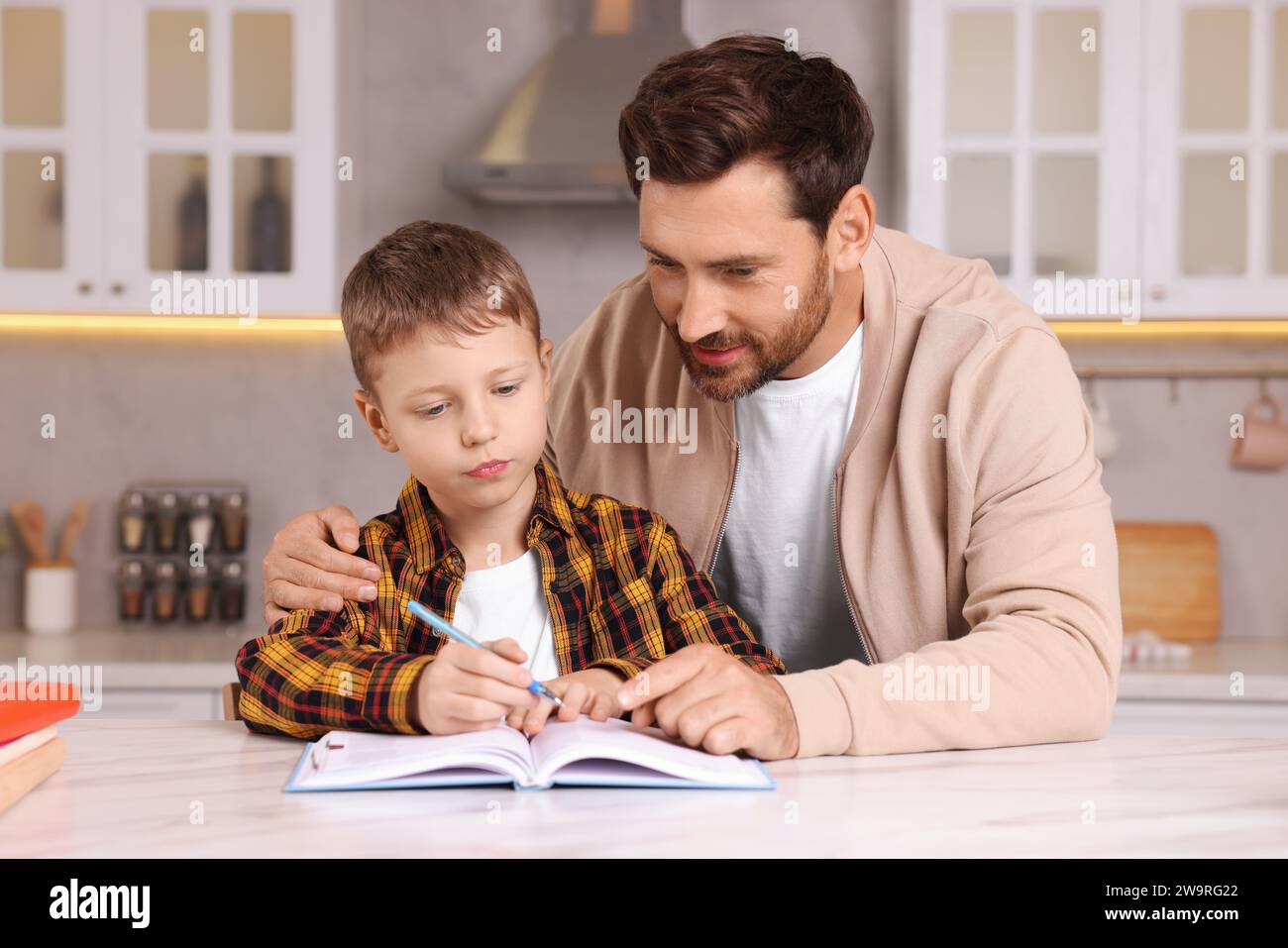 Primary child homework kitchen hi-res stock photography and images - Alamy