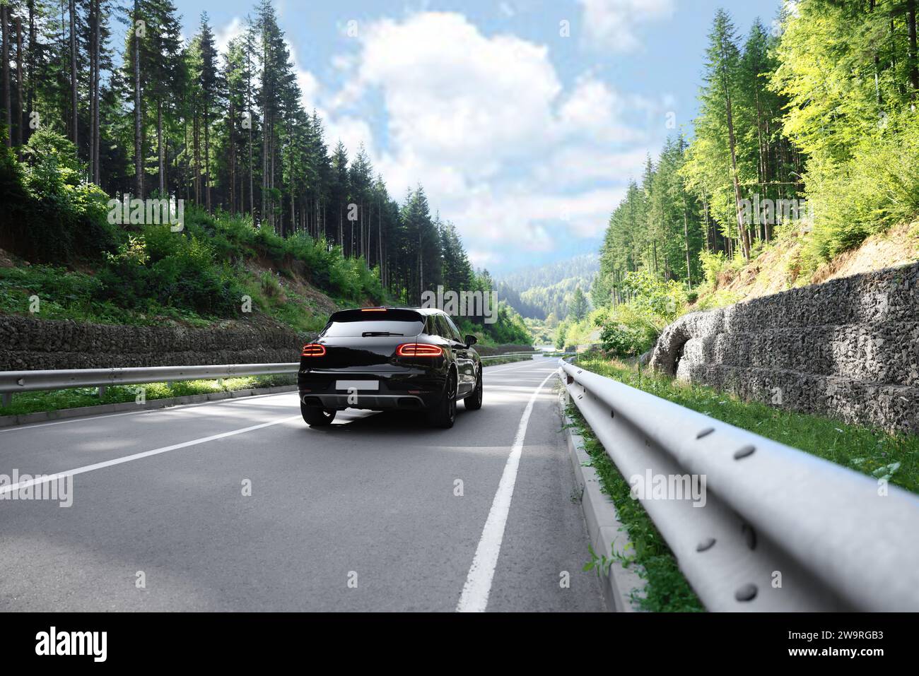 Picturesque view of asphalt road with modern car Stock Photo - Alamy