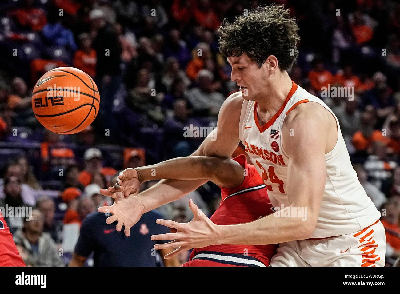 Clemson center PJ Hall (24) loses the ball against Radford guard Kenyon ...