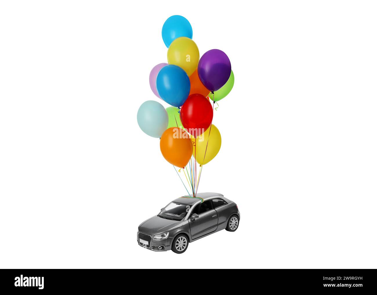 Many balloons tied to toy car flying on white background Stock Photo ...