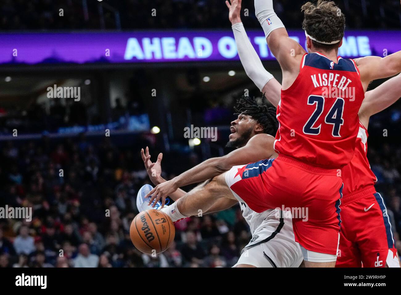 Brooklyn Nets guard Cam Thomas, lower left, can't get a shot past ...