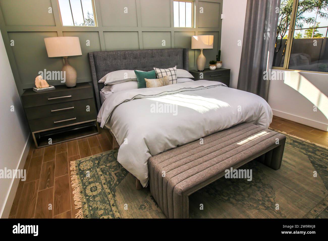 Master Bedroom With Nightstands, Bed And Bench Stock Photo - Alamy