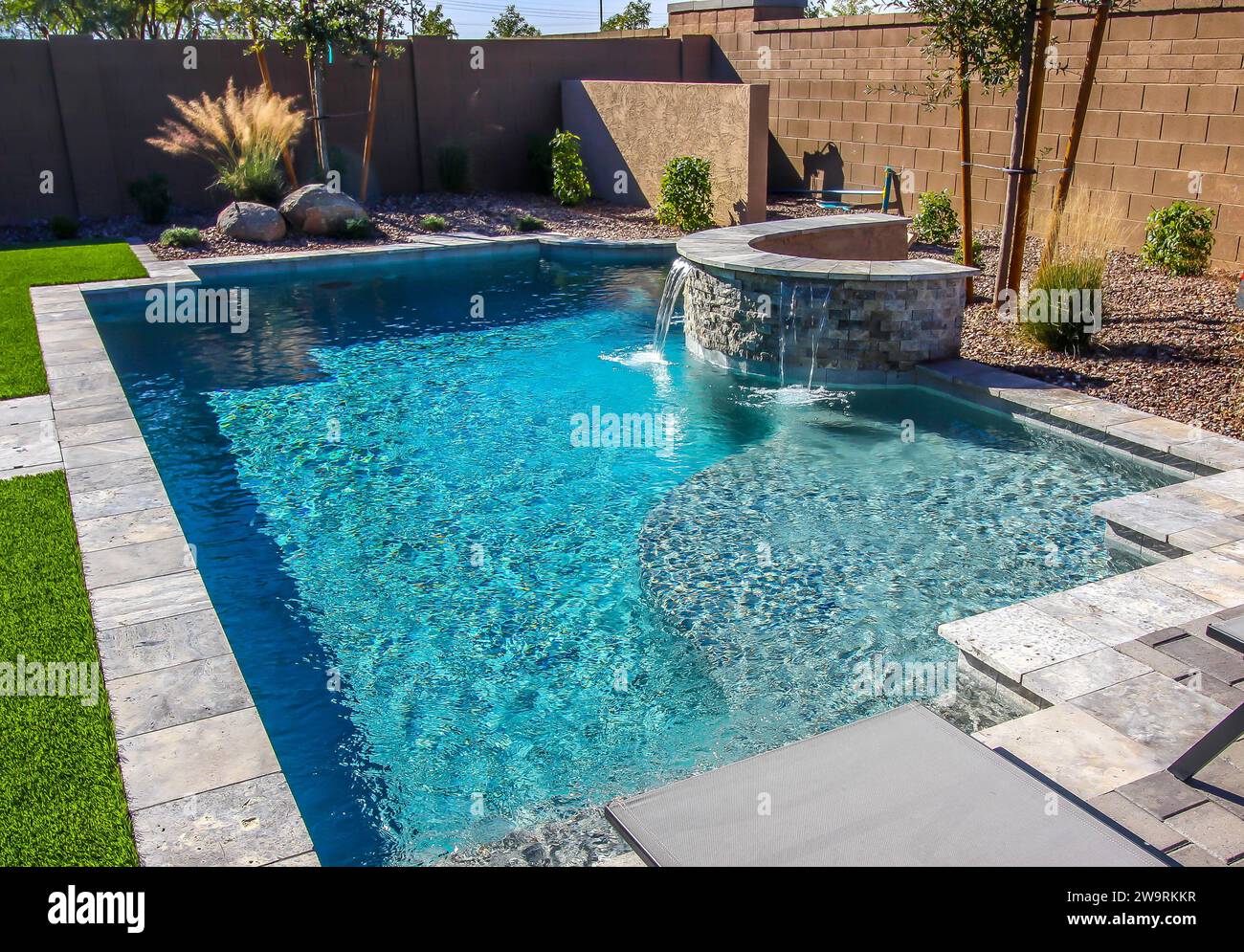 Back Yard Swimming Pool With Waterfall Stock Photo - Alamy