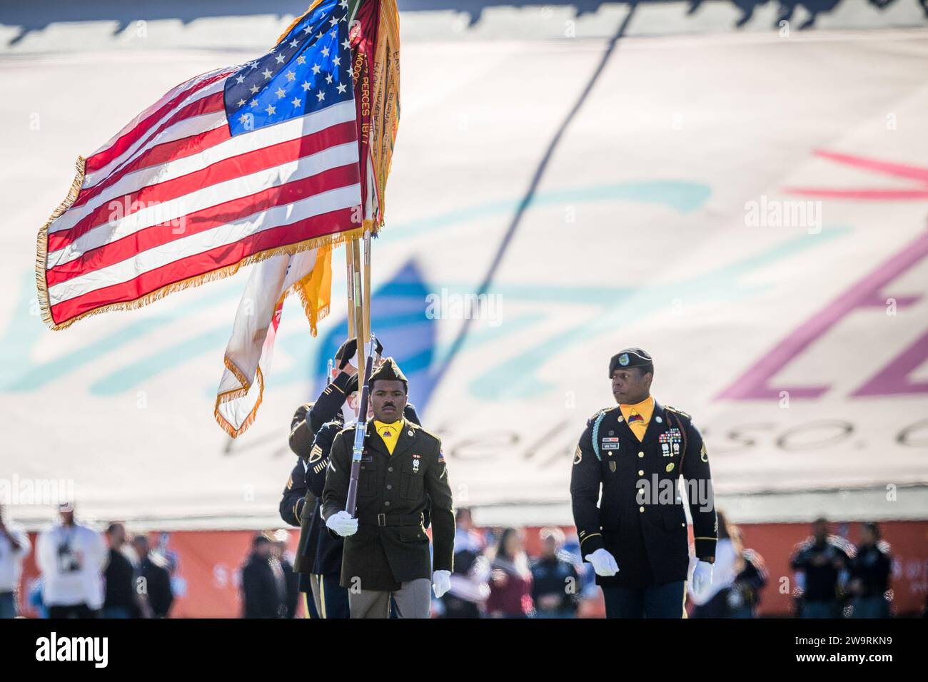 December 29, 2023: Color Guard members perform their duties at the NCAA ...
