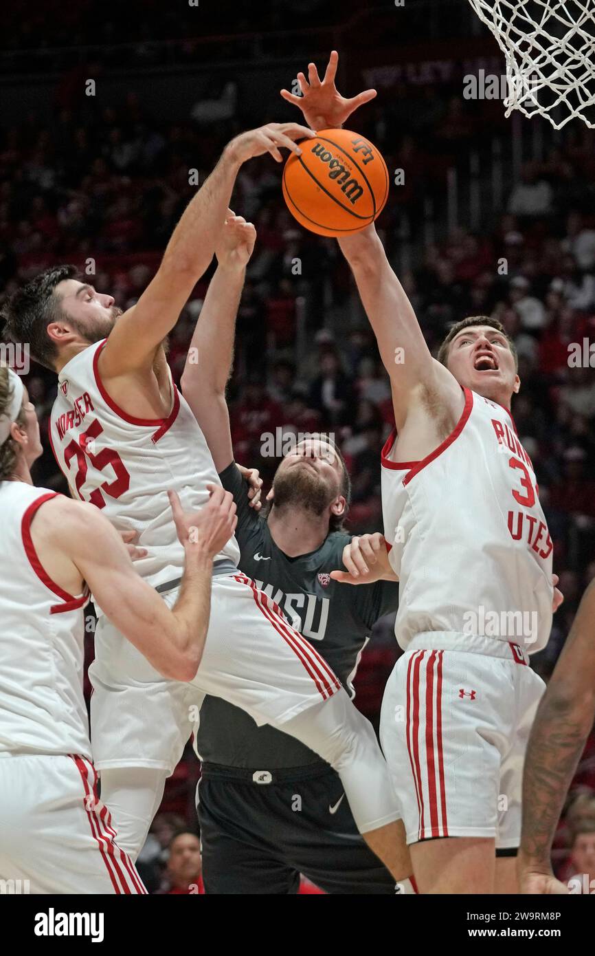 Washington State forward Oscar Cluff, center, battles with Utah's ...