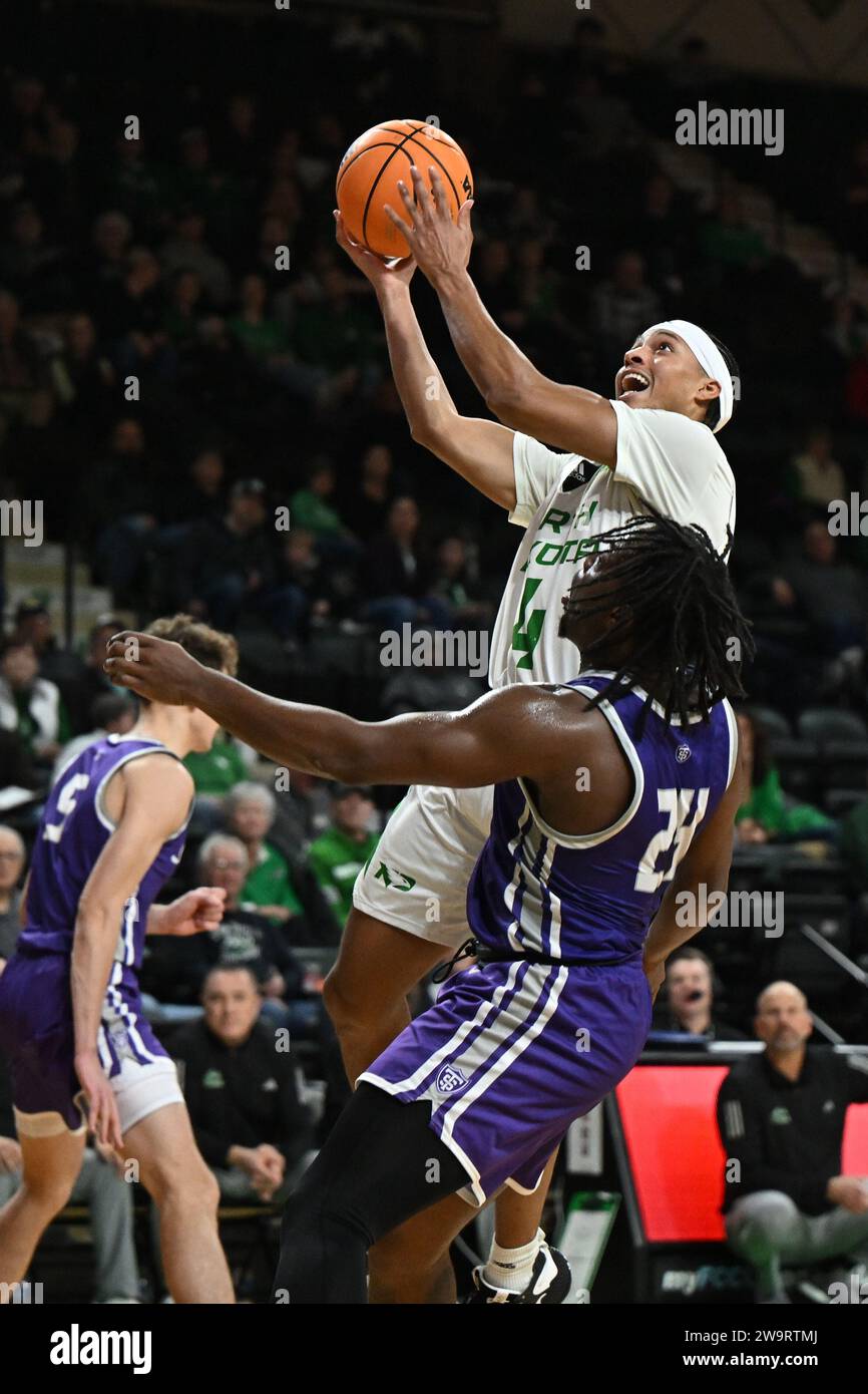North Dakota Fighting Hawks guard Tyree Ihenacho (4) goes up for a shot ...