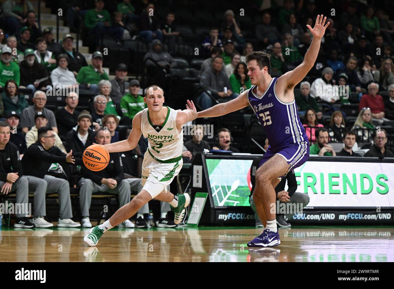 North Dakota Fighting Hawks guard Eli King (2) dribbles towards the basket during a NCAA men's ...