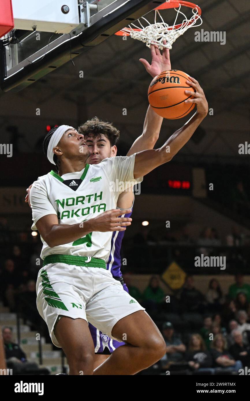 North Dakota Fighting Hawks guard Tyree Ihenacho (4) goes up for a shot ...