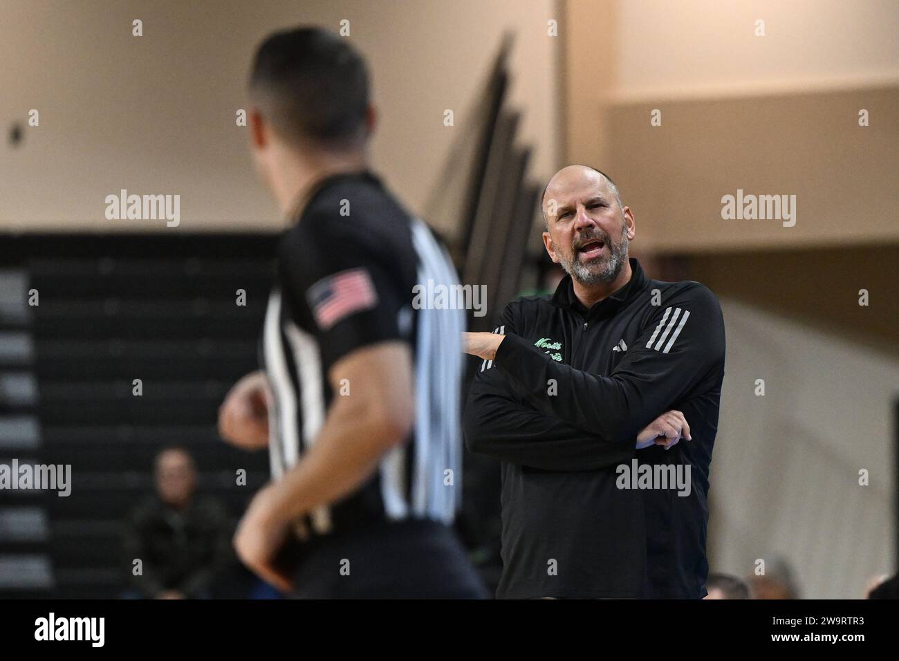 North Dakota Fighting Hawks head coach Paul Sather calls out to an ...
