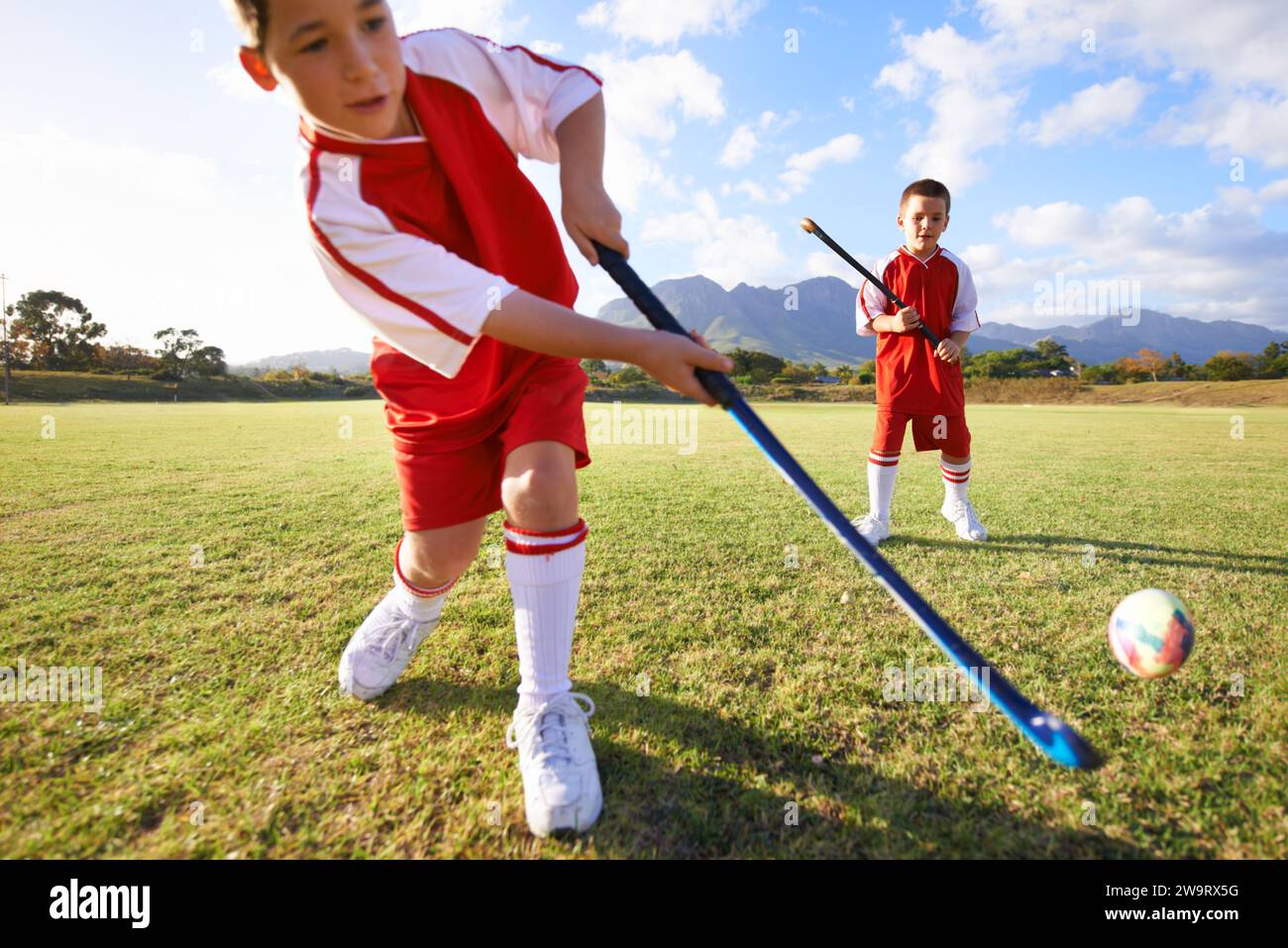 Children playing grass hockey hi-res stock photography and images - Alamy