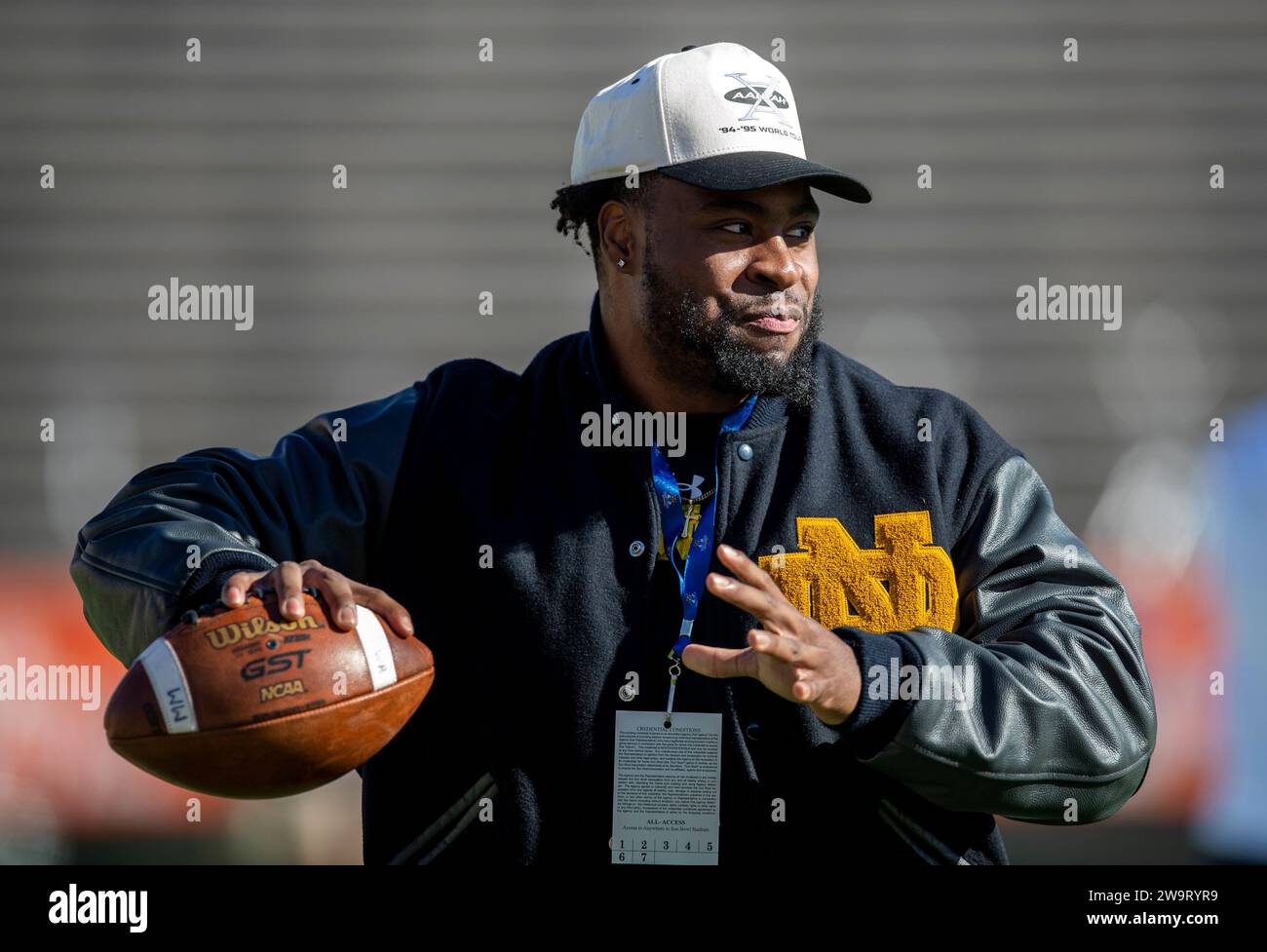 Notre Dame running back Audric Estimé throws a ball during the warmups ...