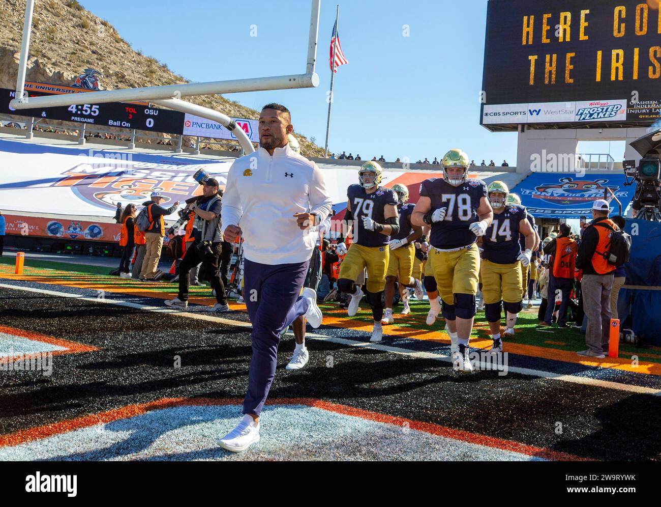 Notre Dame coach Marcus Freeman leads his team onto the field to face ...