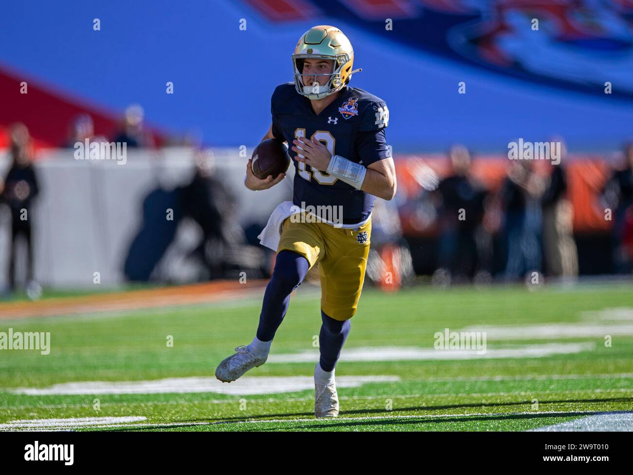 Notre Dame quarterback Steve Angeli (18) runs for yardage during the ...