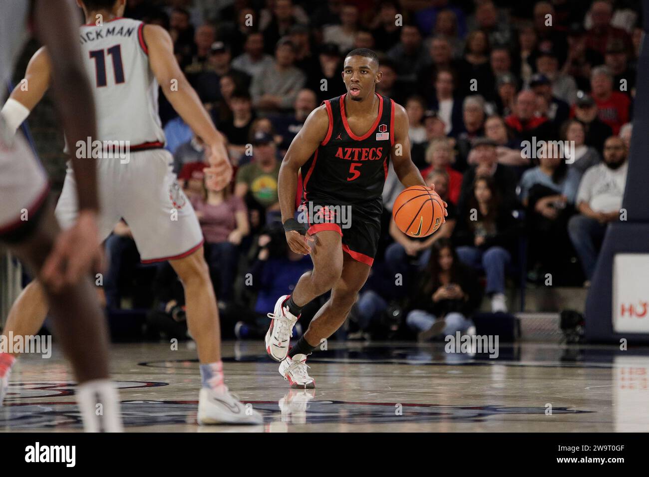 San Diego State guard Lamont Butler (5) controls the ball during the ...