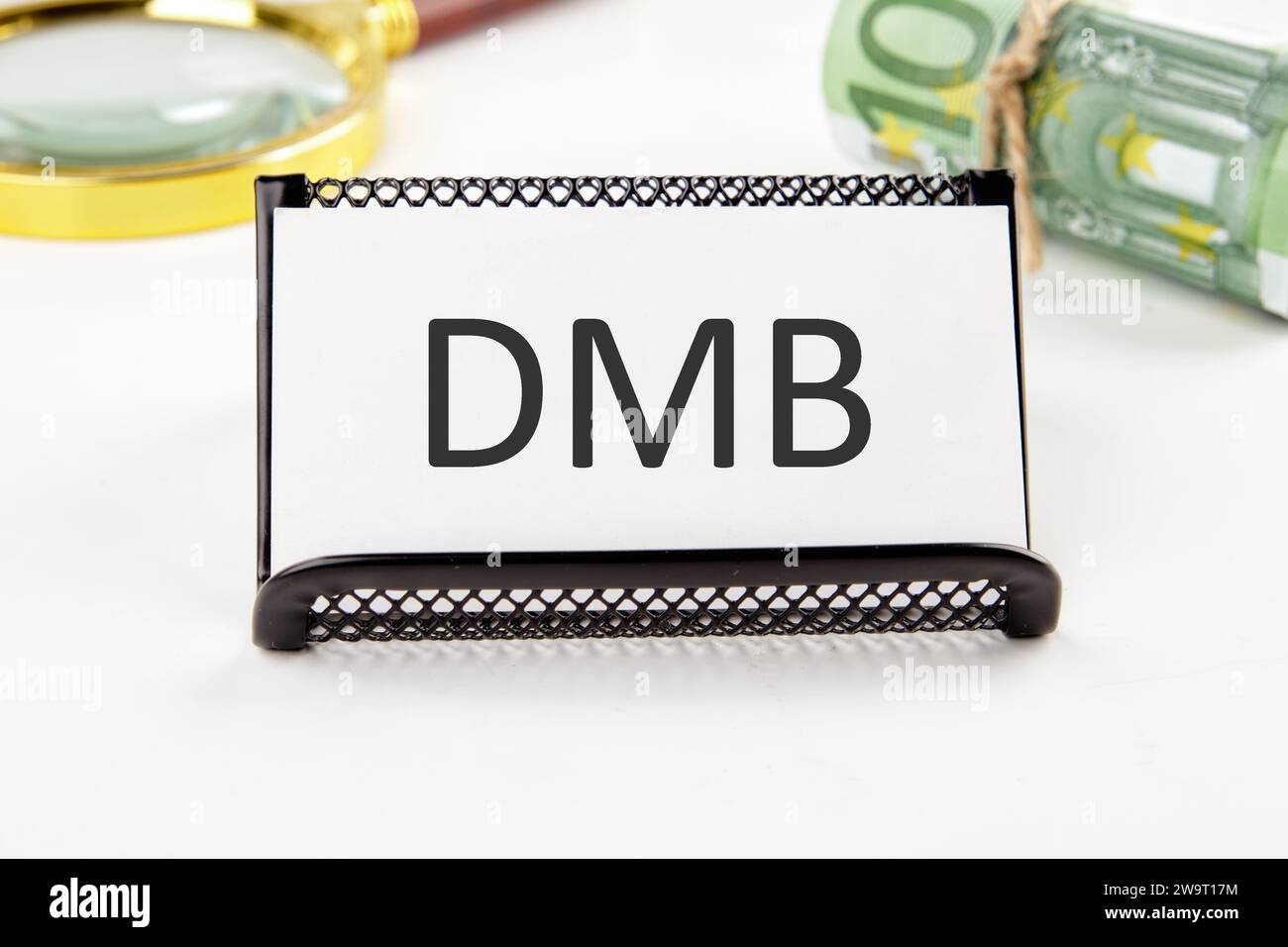 DMB the text on the business card next to the roll of money with a ...