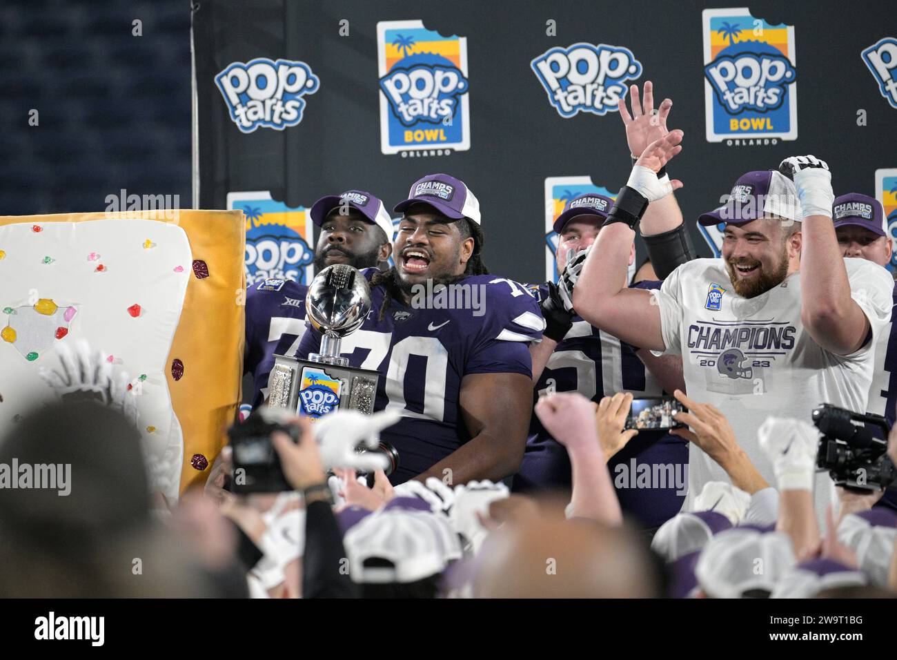 Kansas State offensive lineman KT Leveston (70) holds the championship ...