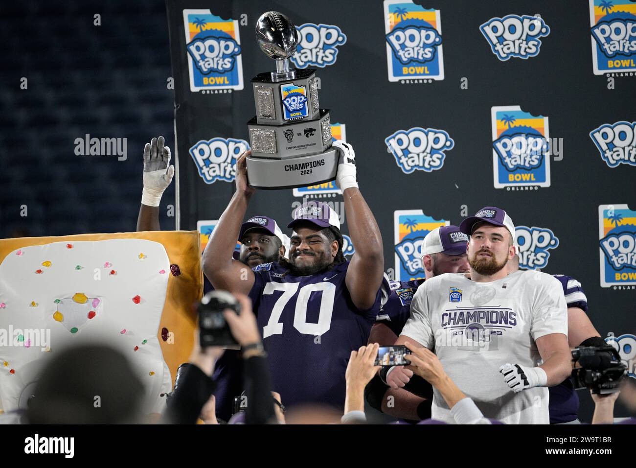 Kansas State offensive lineman KT Leveston (70) holds the championship ...