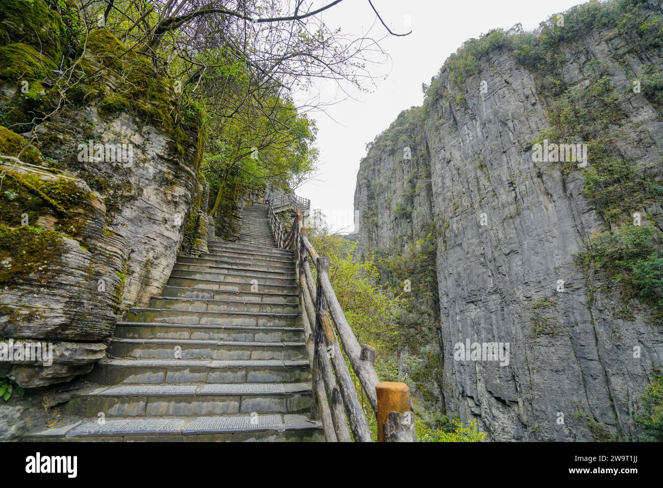 The climbing stone steps are located between two high mountain stone ...