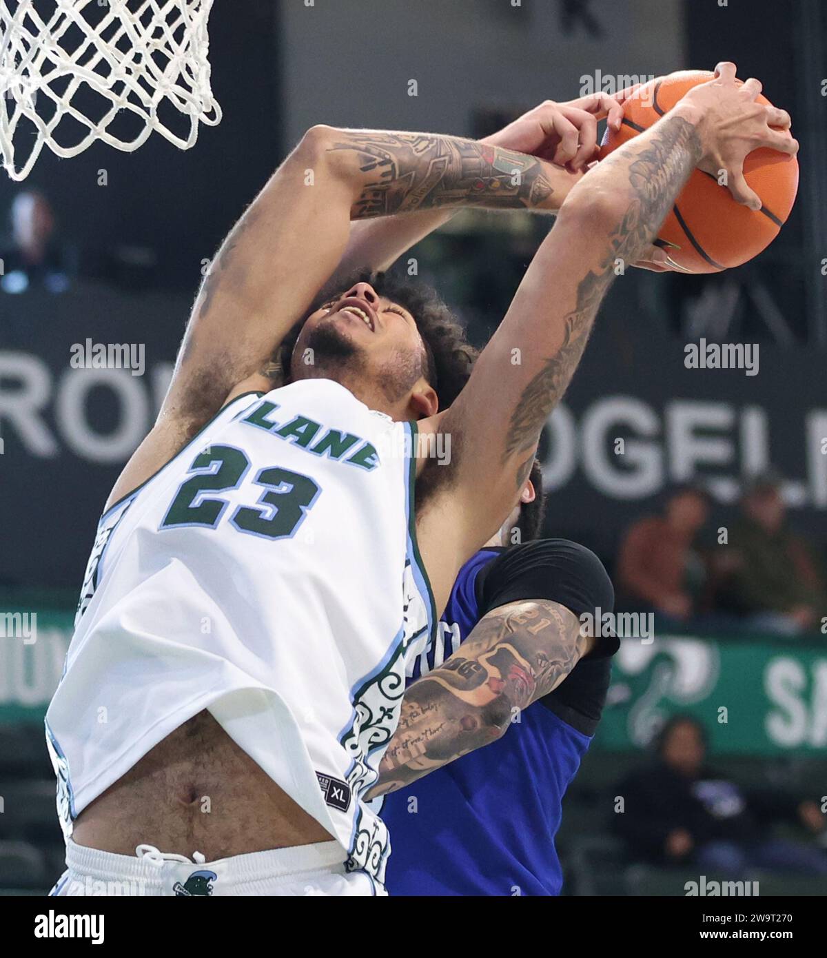 Dillard Bleu Devils forward Mike Reeves (0) blocks Tulane Green Wave ...