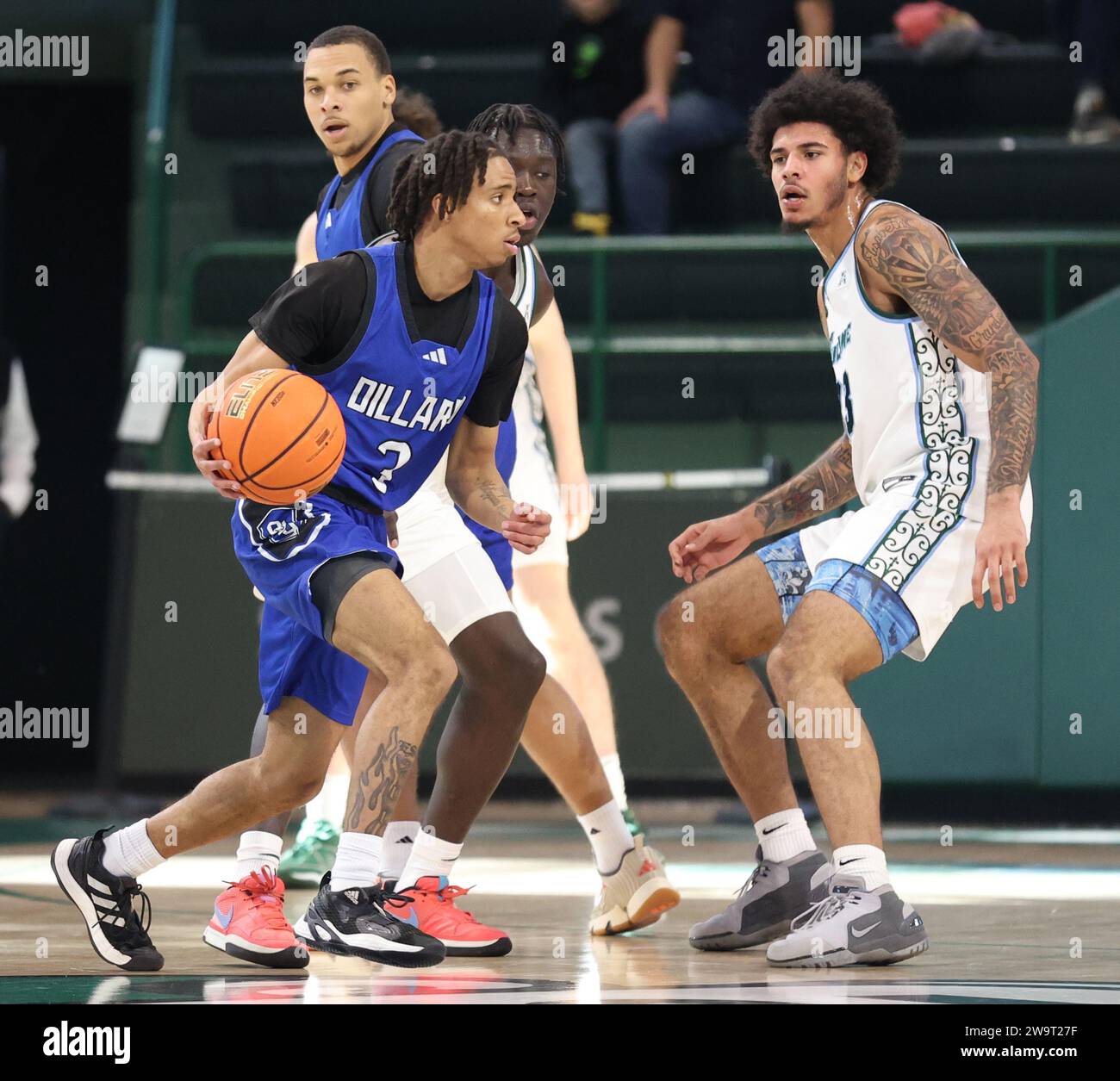 Dillard Bleu Devils guard Christian Pinchon Jr. (3) tries to drive past ...