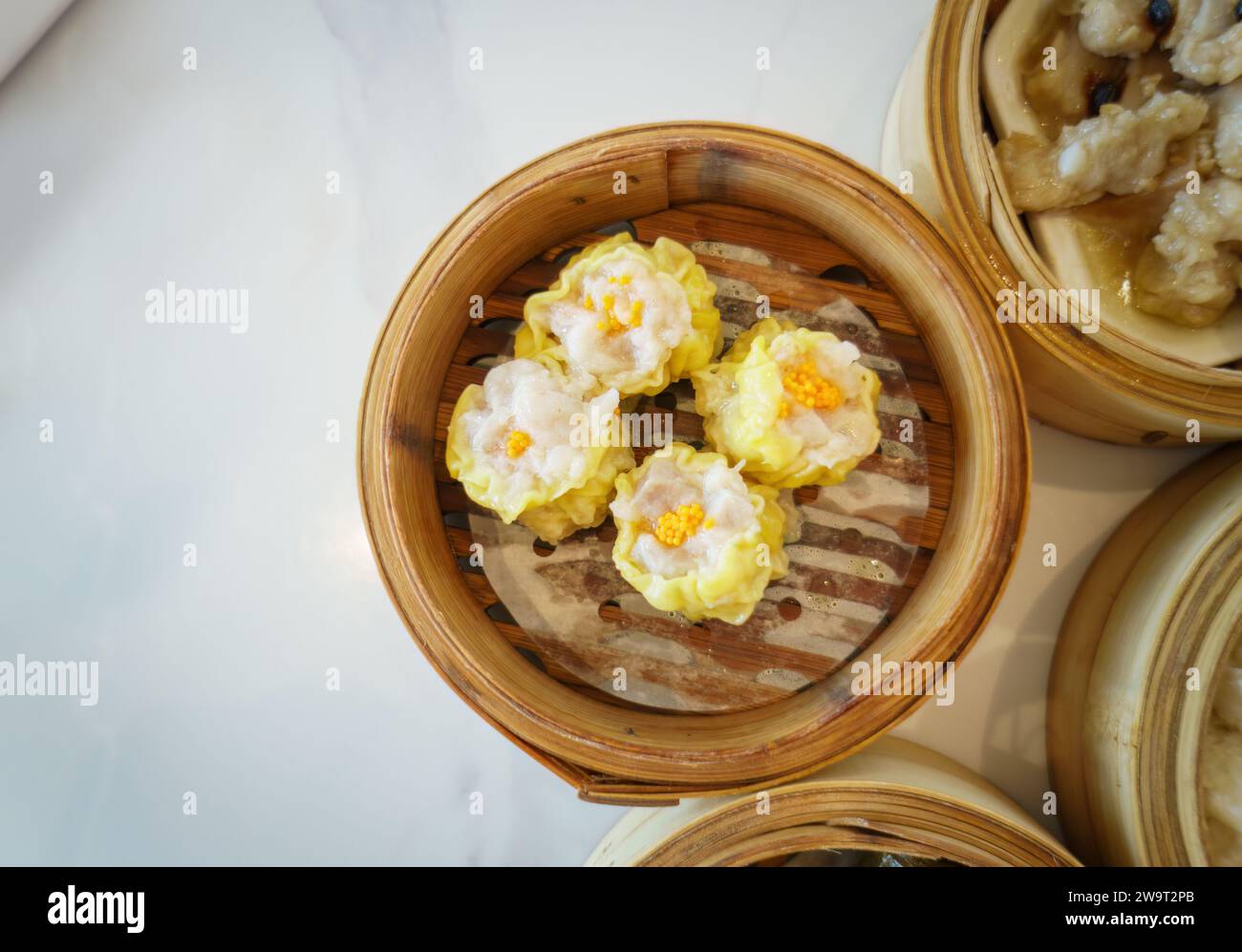 Aerial view of yum cha, dim sum in bamboo steamers. Chinese cuisine ...