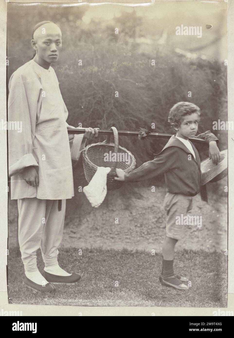 Portrait of a Chinese man and a European boy with a basket, c. 1879 - c ...