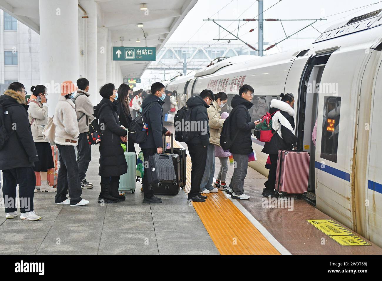 YANTAI, CHINA - DECEMBER 30, 2023 - Passengers travel at Yantai South ...