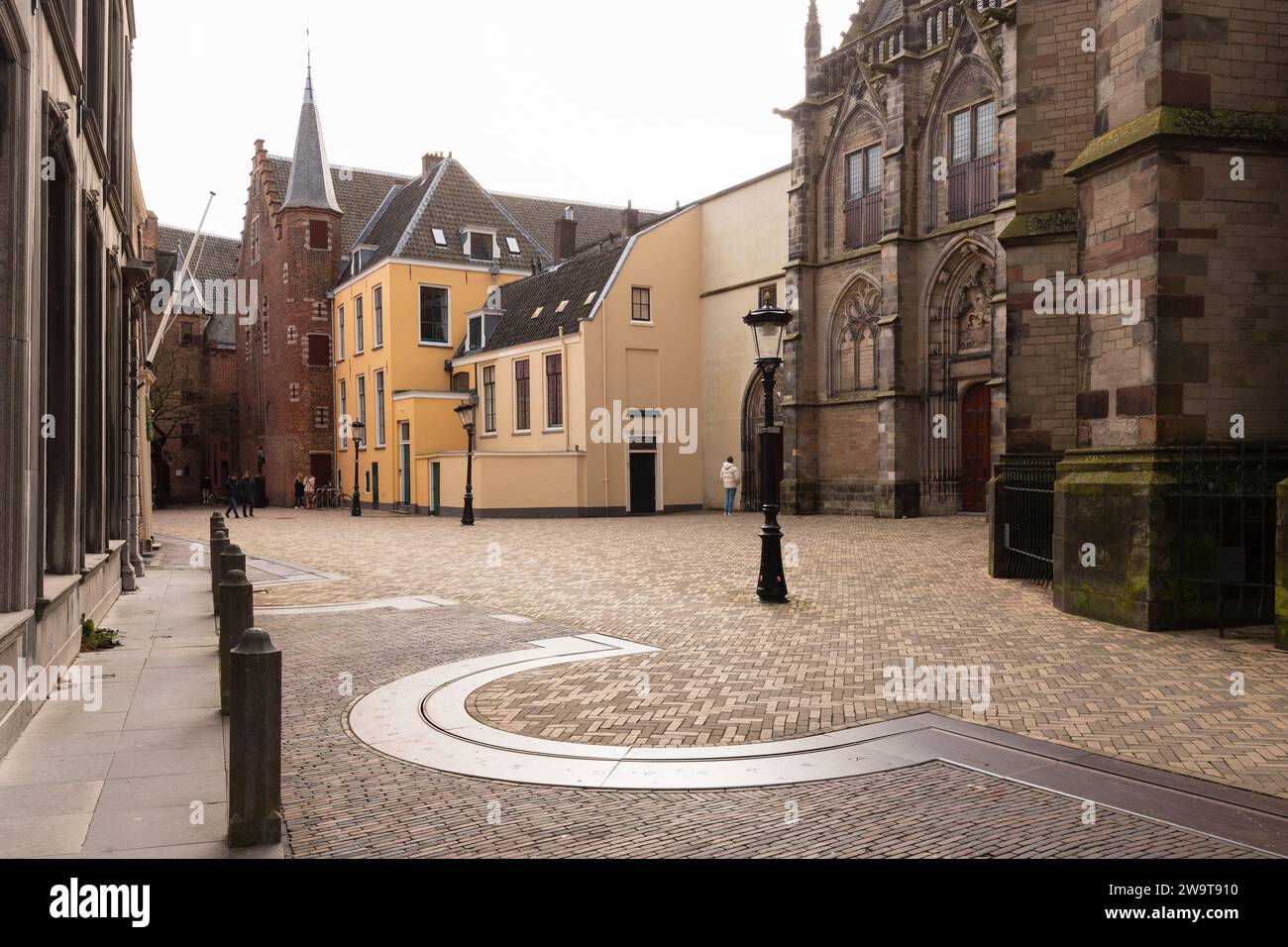 Historic medieval street with the Gothic cathedral (Domkerk) in the ...