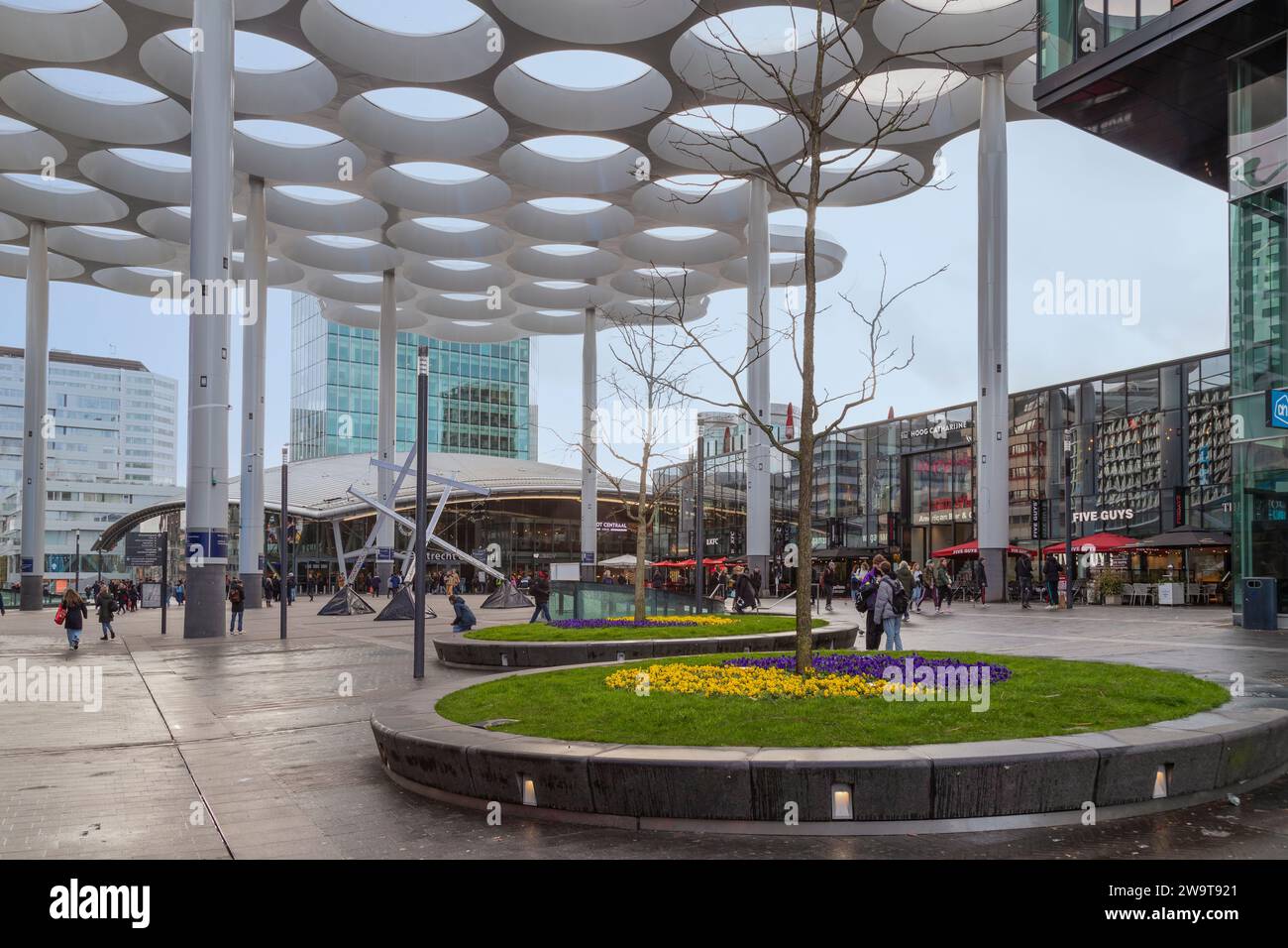 Station square with modern roof at the station and shopping center in ...