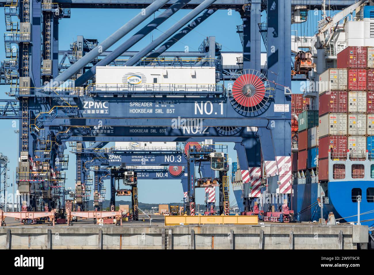 A large fully loaded container vessel moored at Patrick Sydney AutoRail ...